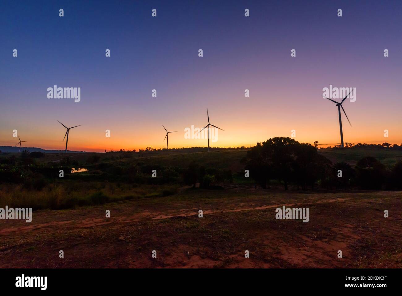 wind turbines park for make the electric power from wind in sunset time ...