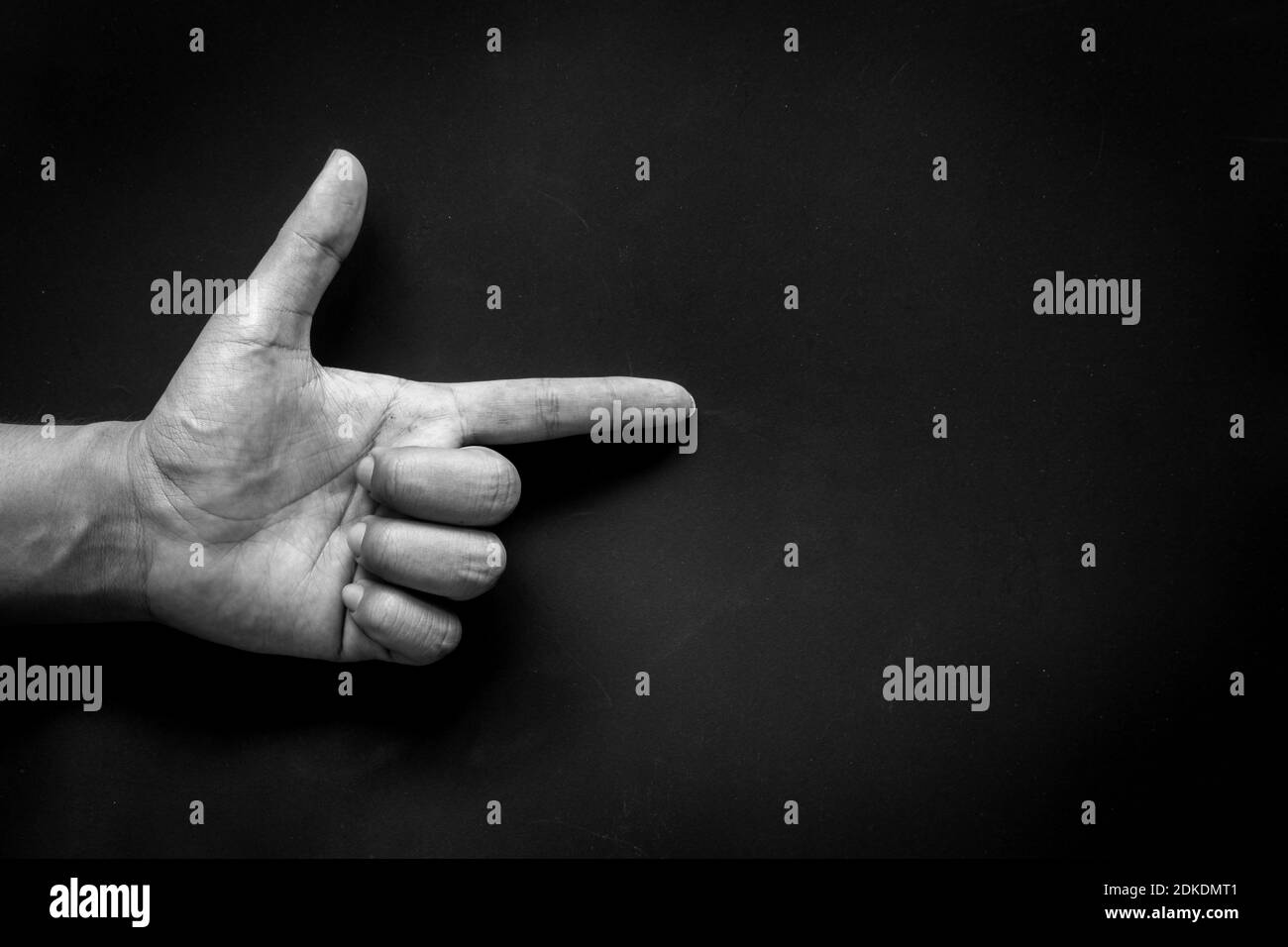 Hands point a blank on black background Stock Photo - Alamy