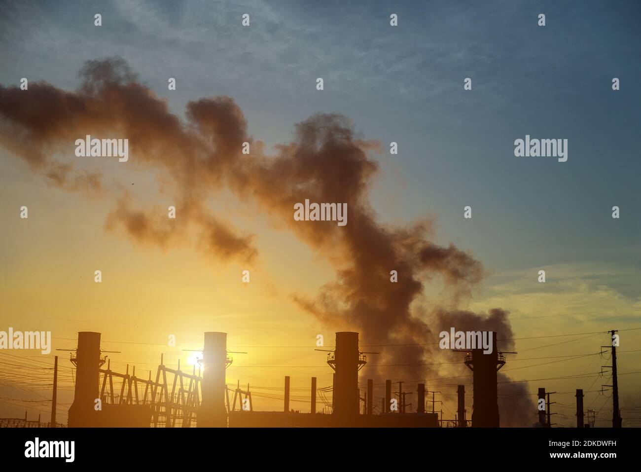 At dusk, the thermal power plants with during sunrise factory pipe ...