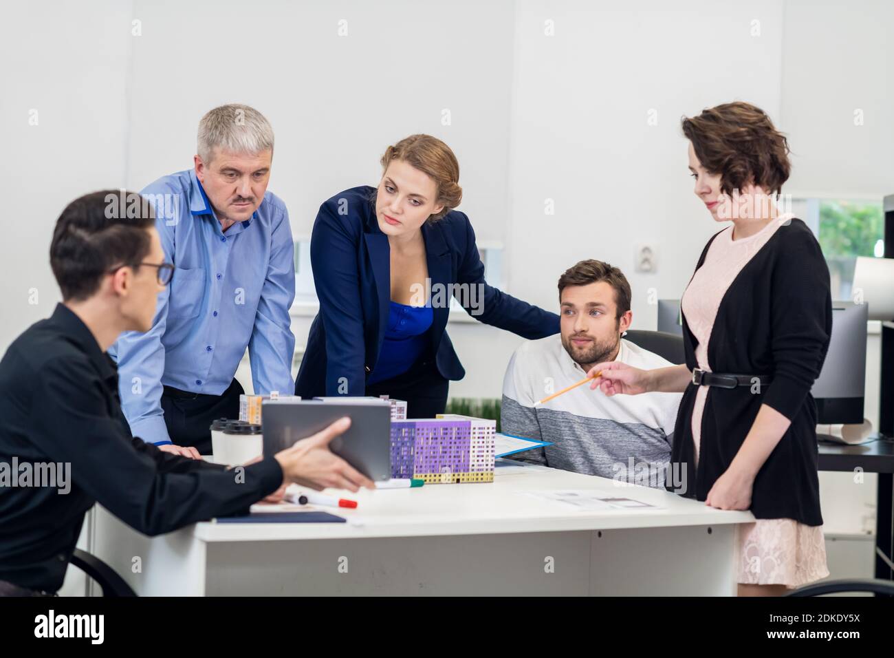 Senior grey haired businessman discussing hi-res stock photography and ...