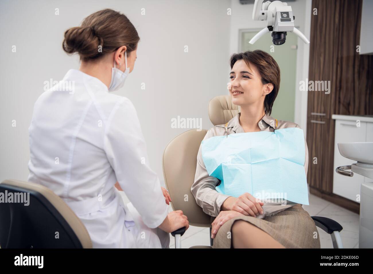Closeup portrait of a smiling happy patient in adental clinic ...