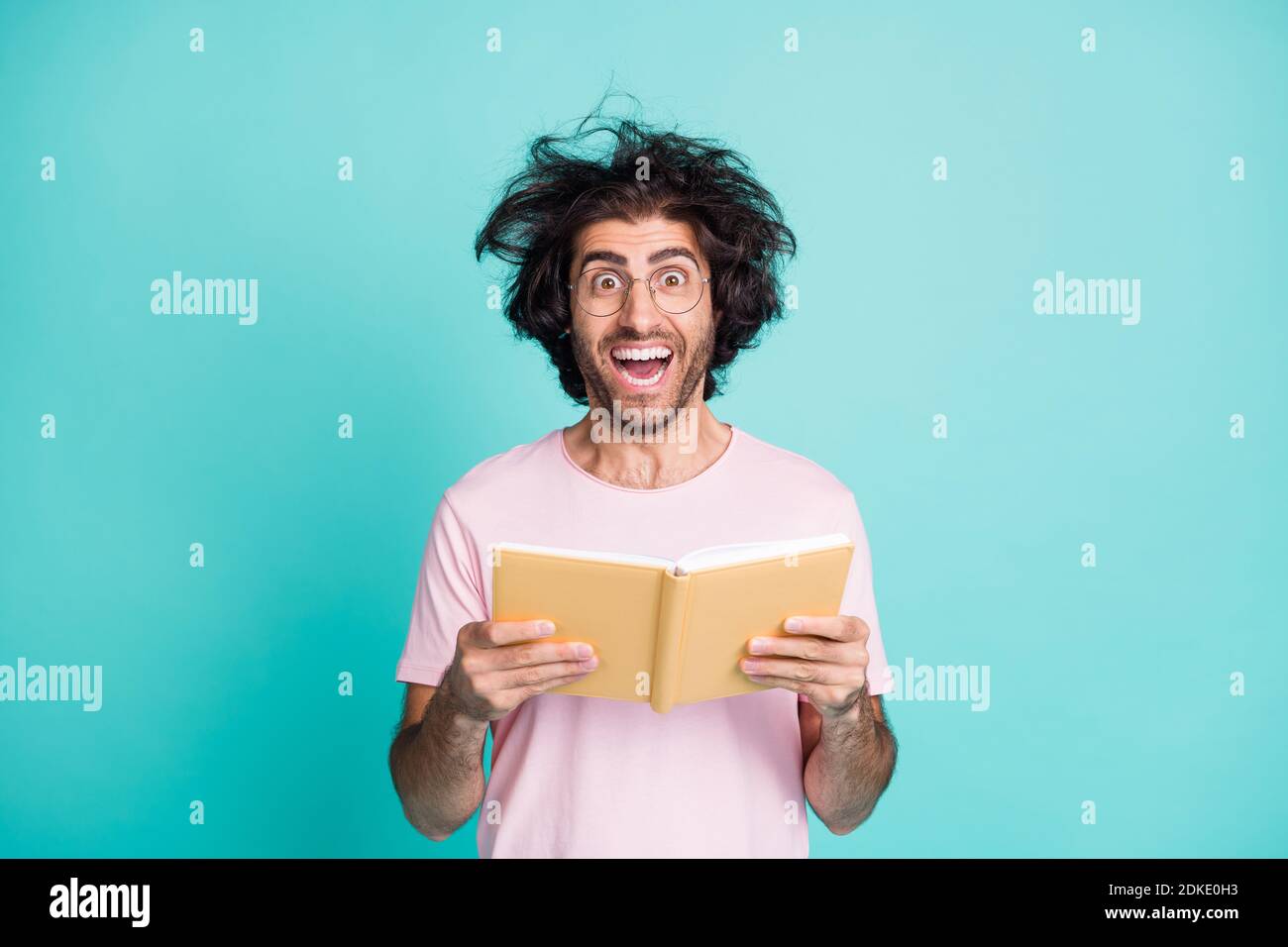 Portrait of impressed reaction person hands hold book fascinated story ...