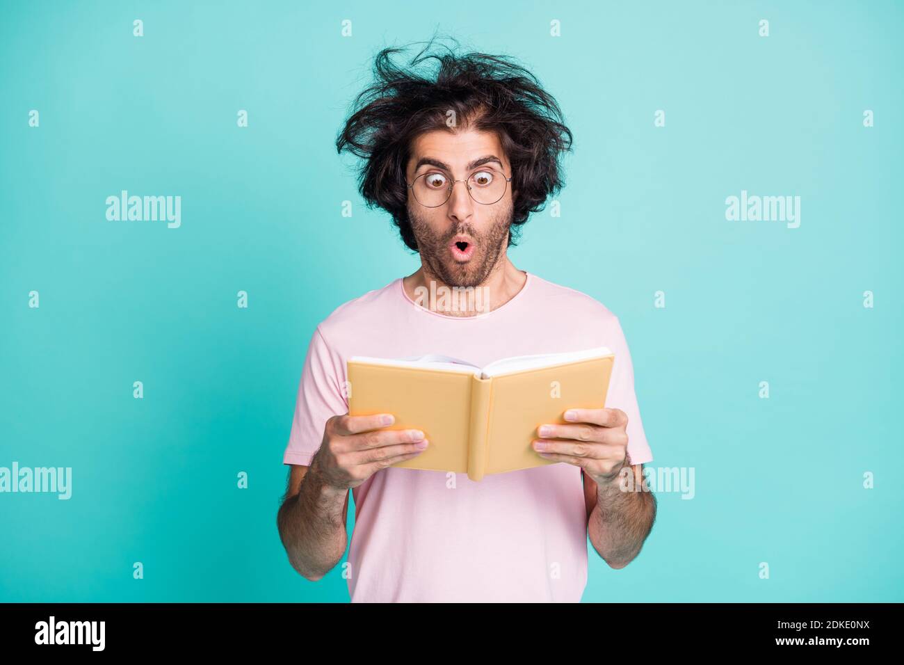 Photo of confused person arms hold book read scary story open mouth ...