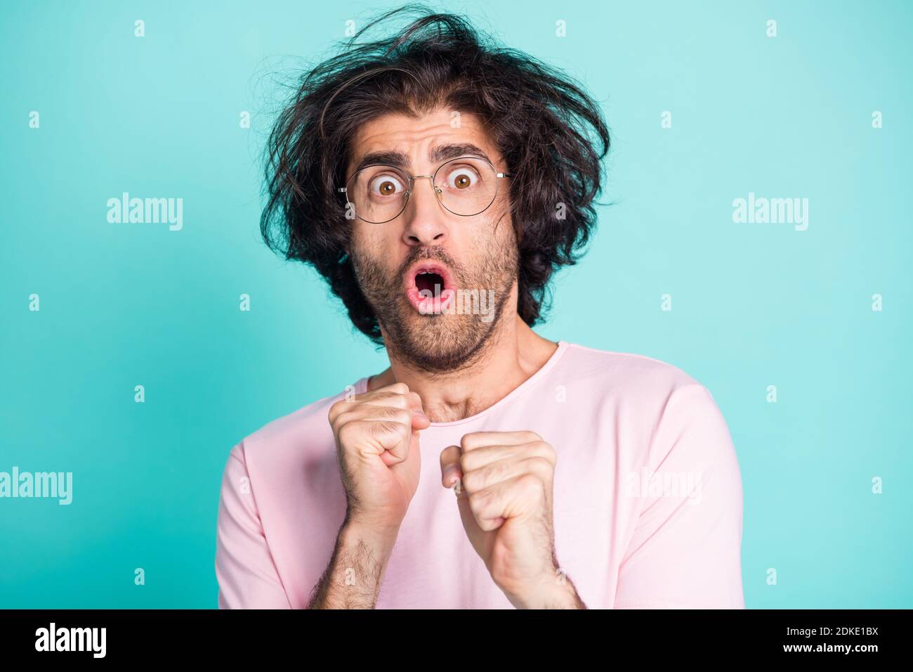 Close up photo of scruffy hairstyle man shocked face hands fist up ...