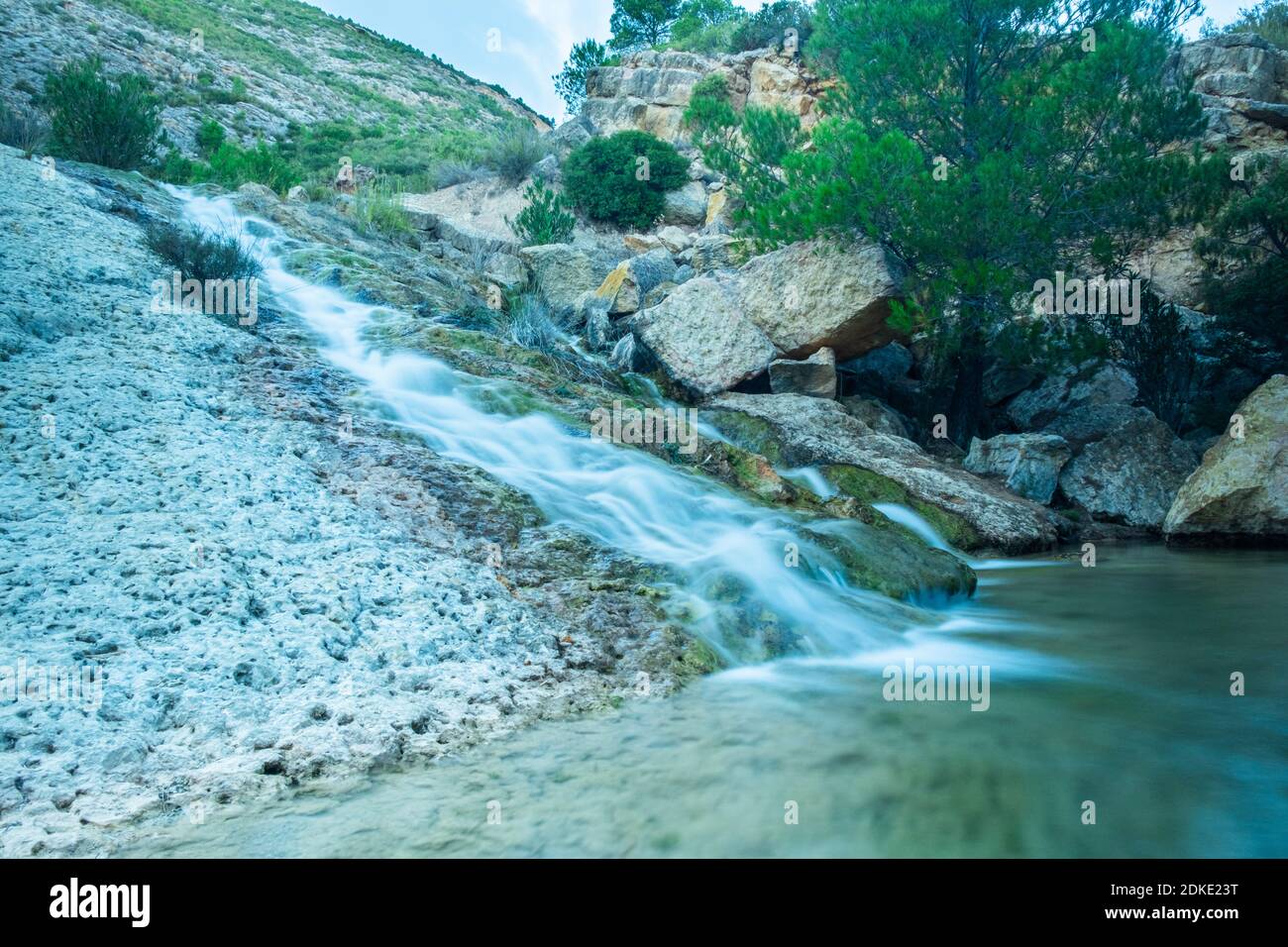A small beautiful waterfall with the rocks Stock Photo - Alamy