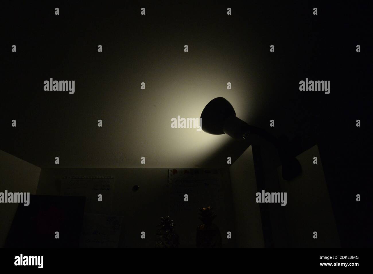 Spotlight illuminating the white wall and its shadows Stock Photo - Alamy