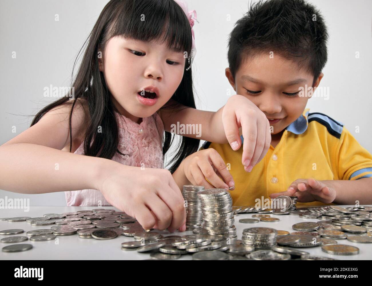 Boy girl counting money hi-res stock photography and images - Alamy