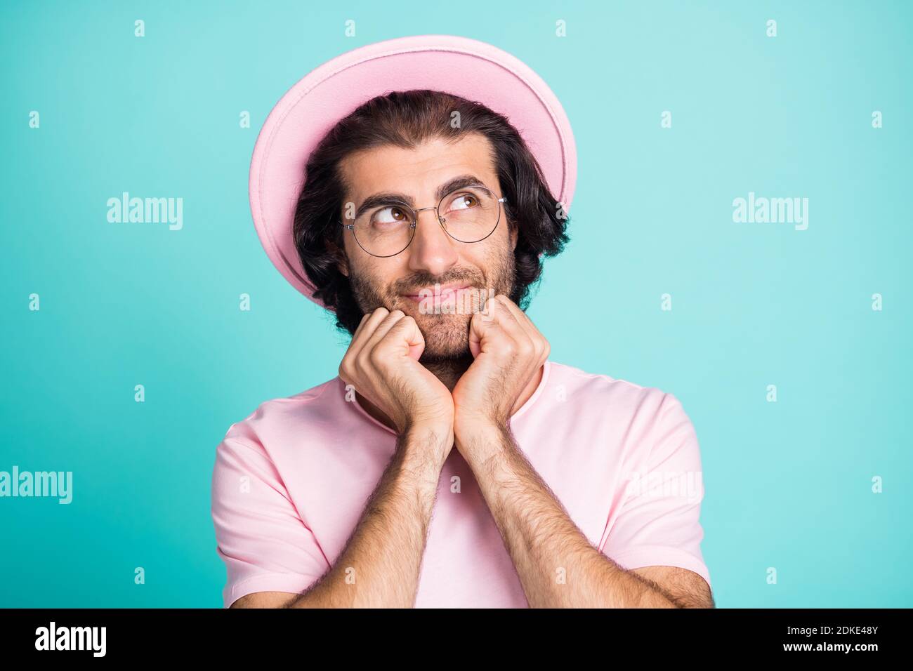 Photo portrait of curious cunning man wearing hat thinking touching ...