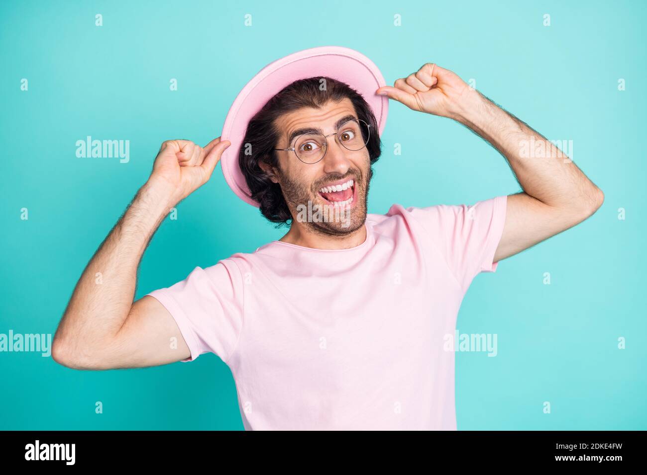 Photo portrait of curious cheerful man wearing glasses pink casual ...
