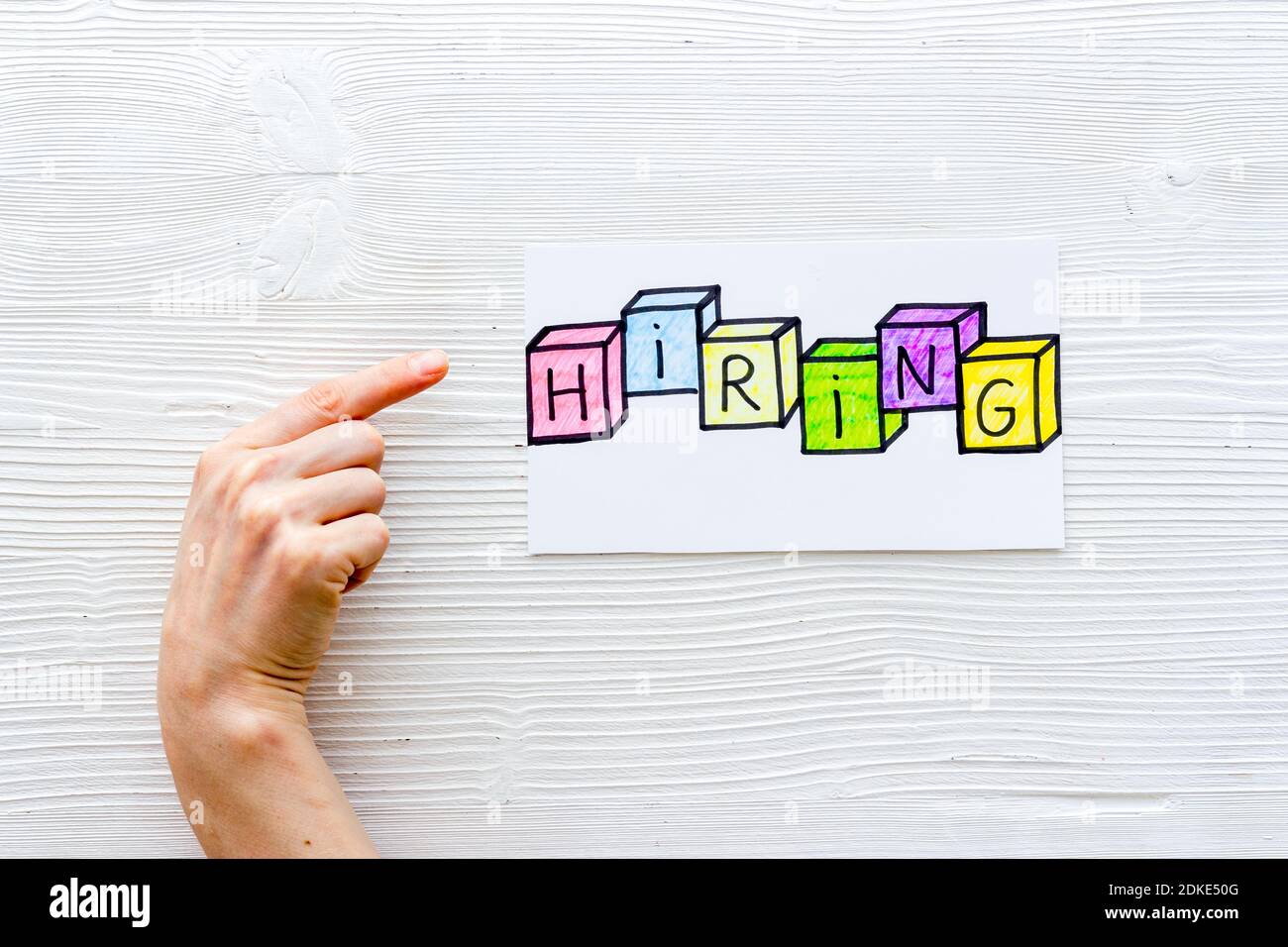 Hiring - job recruting concept. Word Hiring on paper banner, top view ...