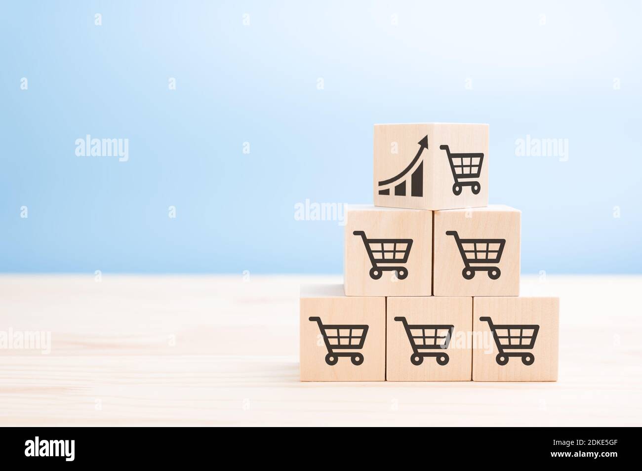 pyramid of wooden cubes with sales icons. Sale volume increase make ...