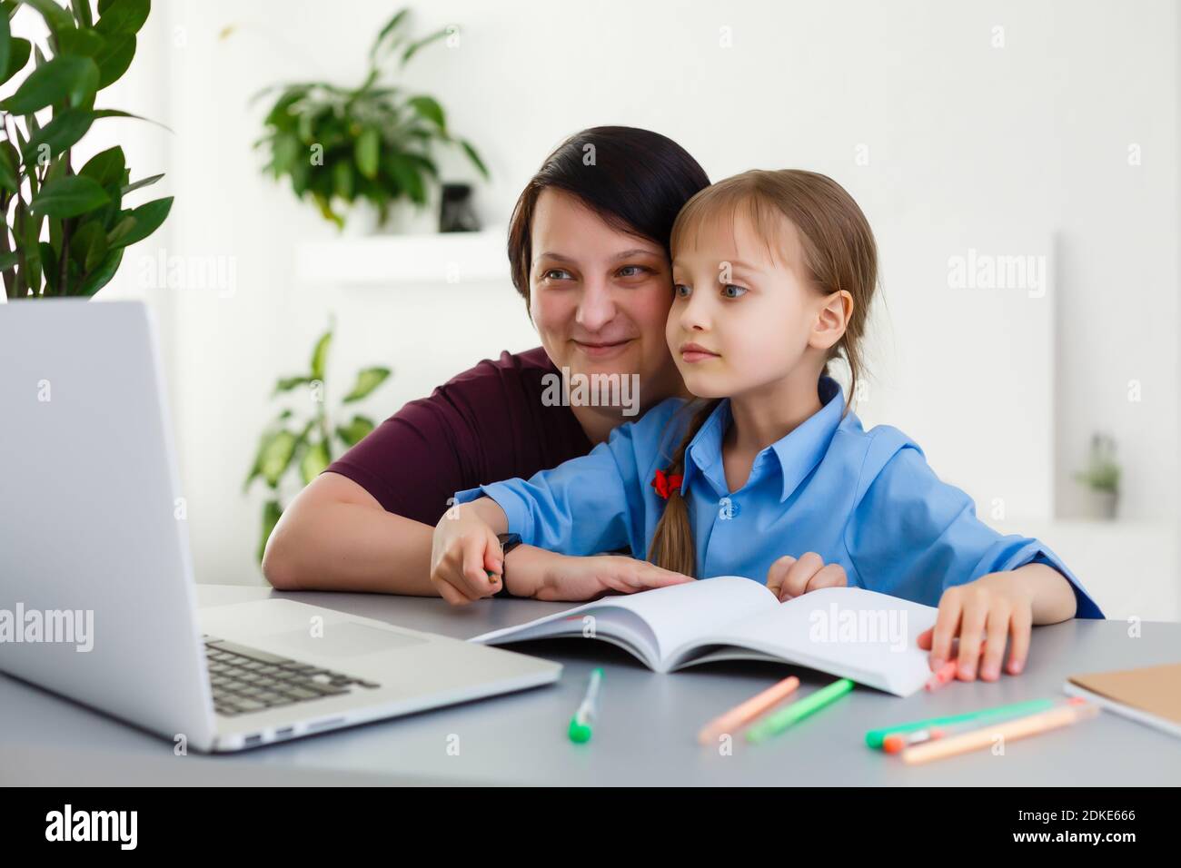 Remote lessons. The child smiles happily and gets knowledge remotely ...