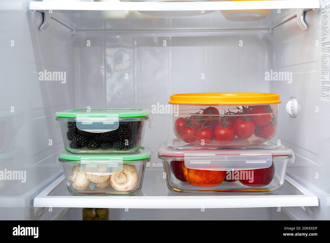 Storage containers with fresh food in a fridge Stock Photo - Alamy