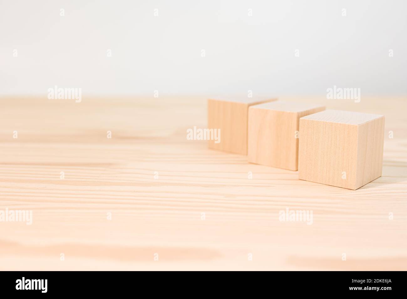 three wooden cubes for your text, icons, sign and symbols to create ...