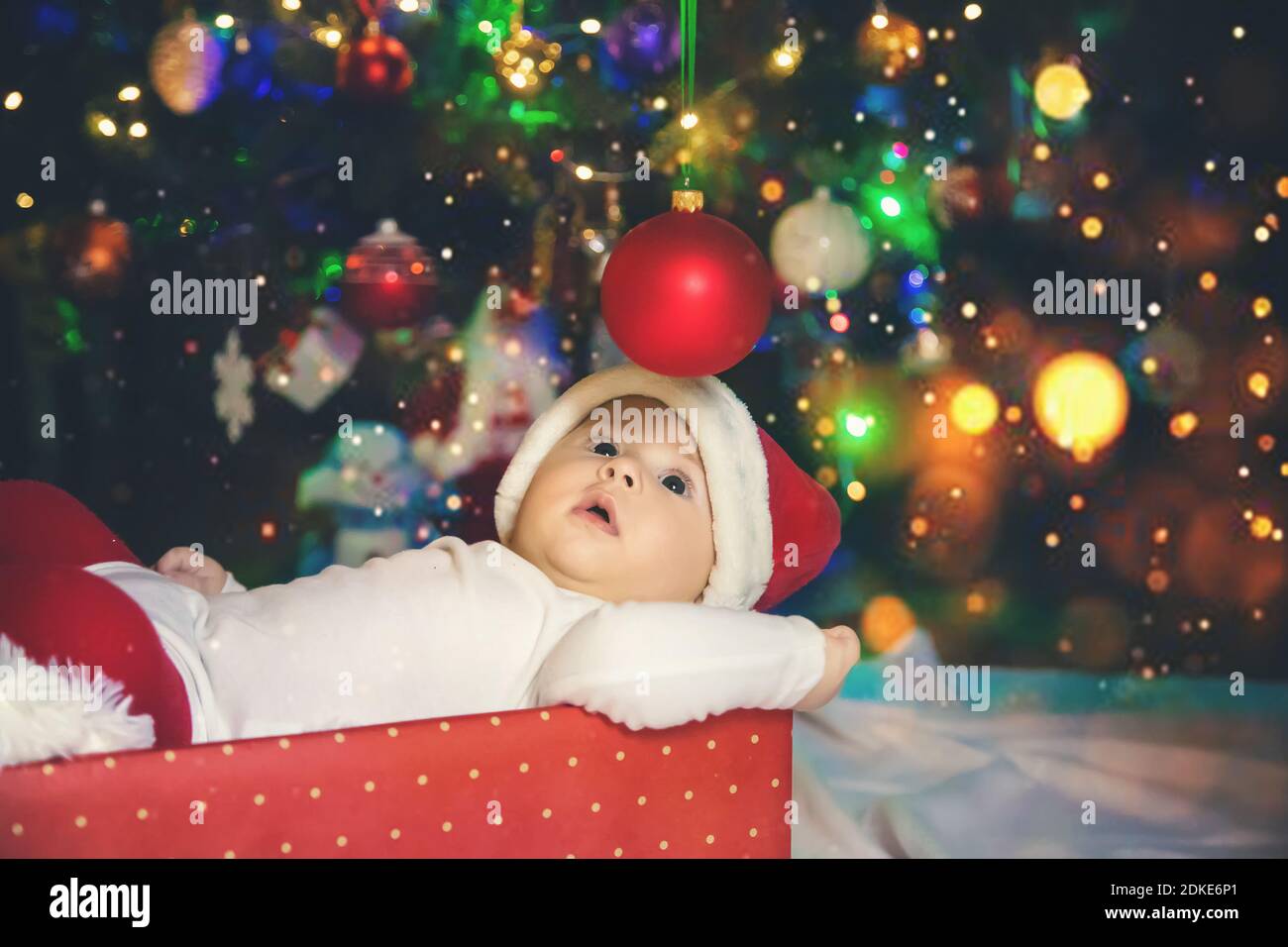 Baby is under the tree, Christmas. Selective focus. Holiday Stock Photo ...