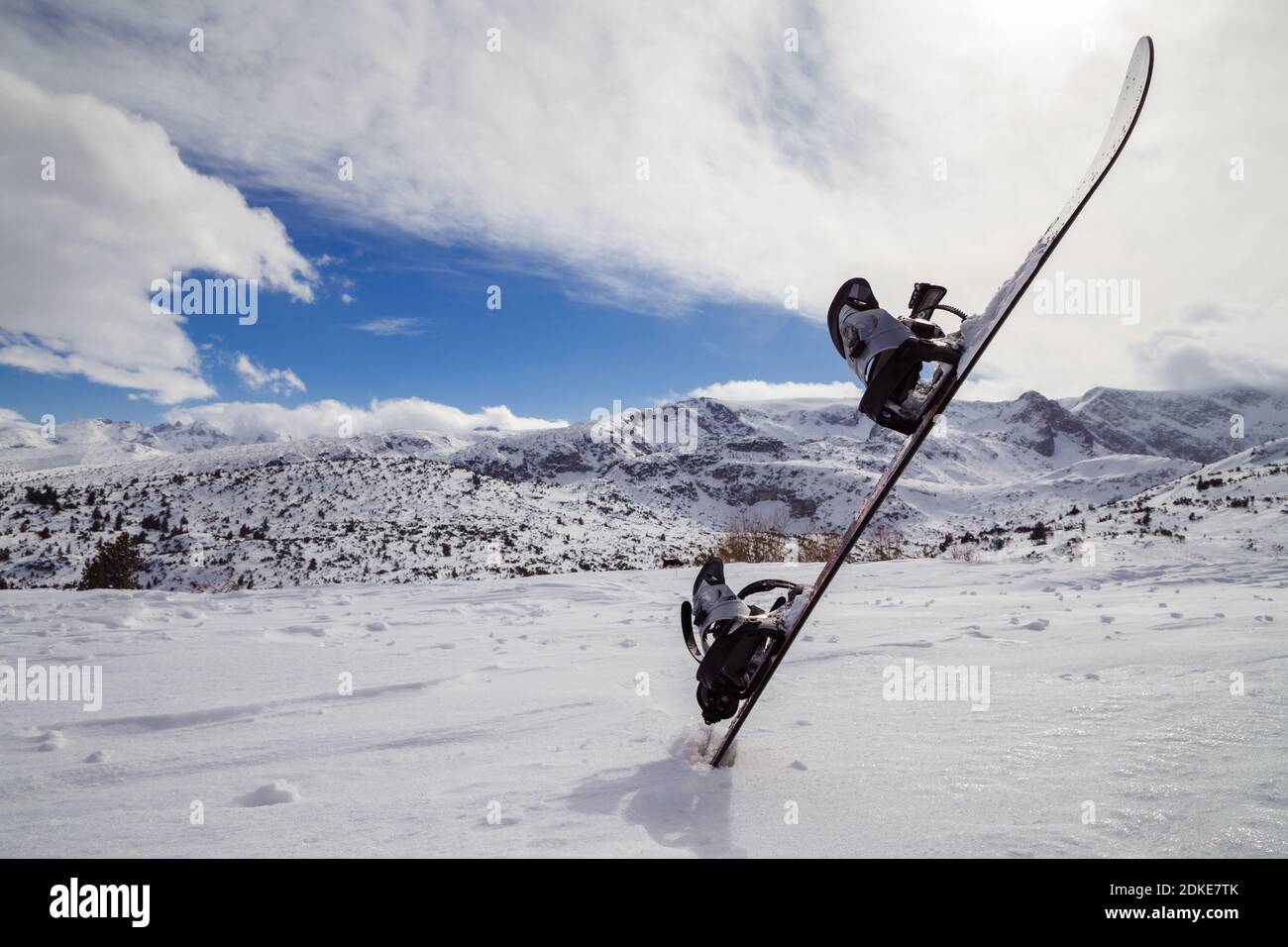 Snowboard in the snow in the snowy mountain. Getting ready for a free ...