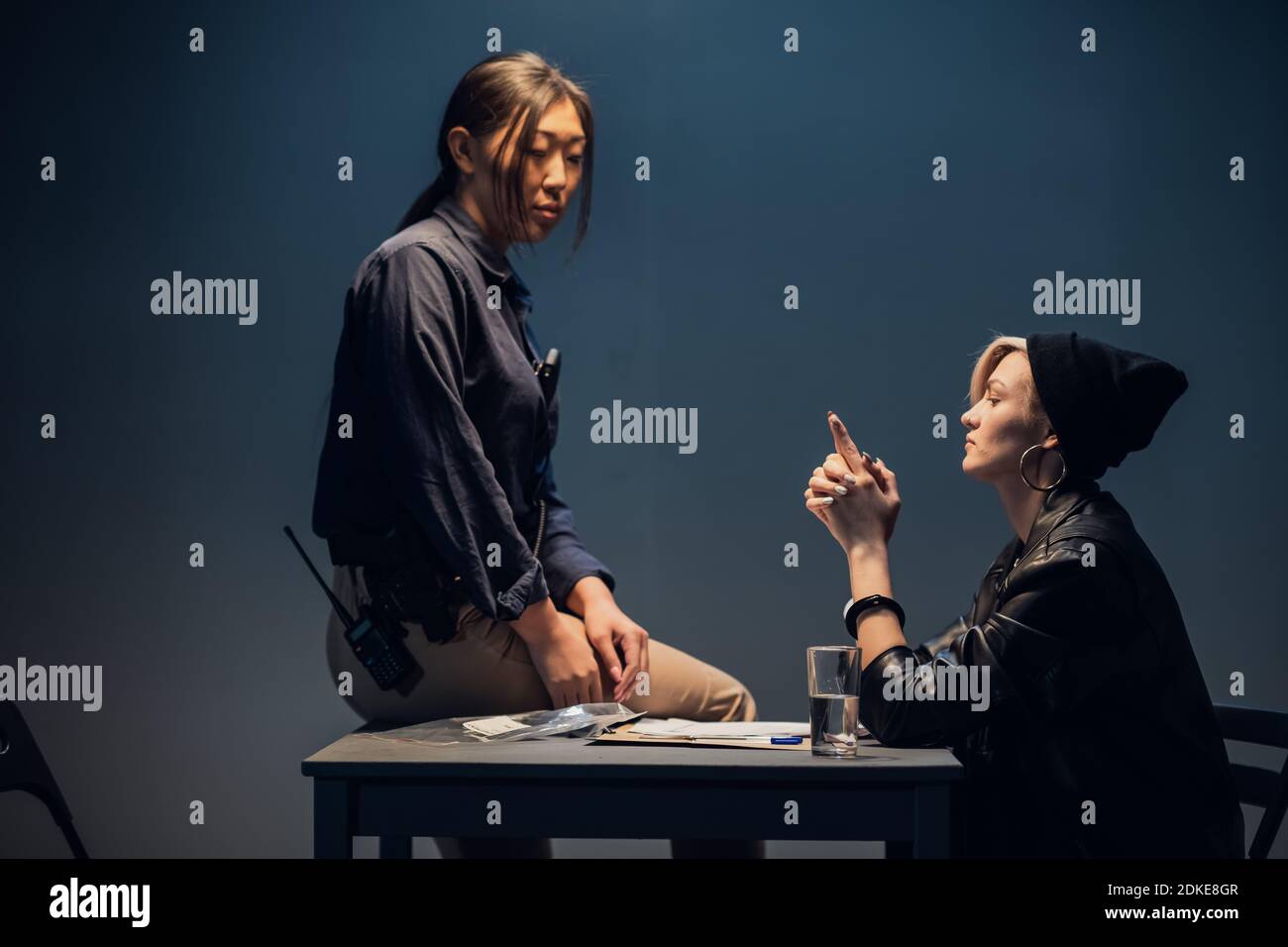A young investigator an asian woman sits on a table during the ...