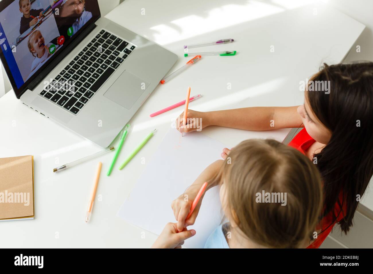 Cool online school. Kids studying online at home using a laptop ...