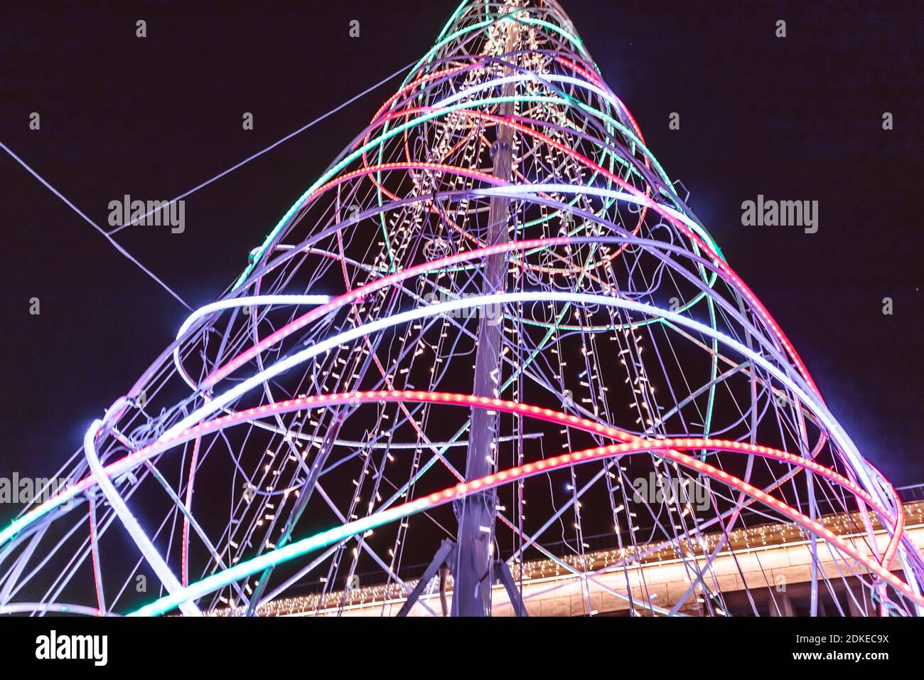 futuristic Christmas tree in the square neon glow colorful lights Stock ...