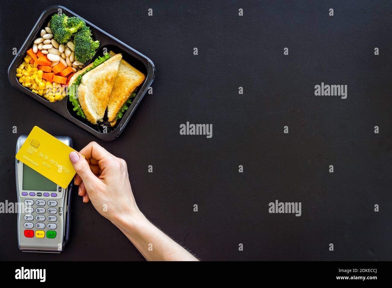 Food delivery payment with terminal and lunch boxes with meal Stock ...