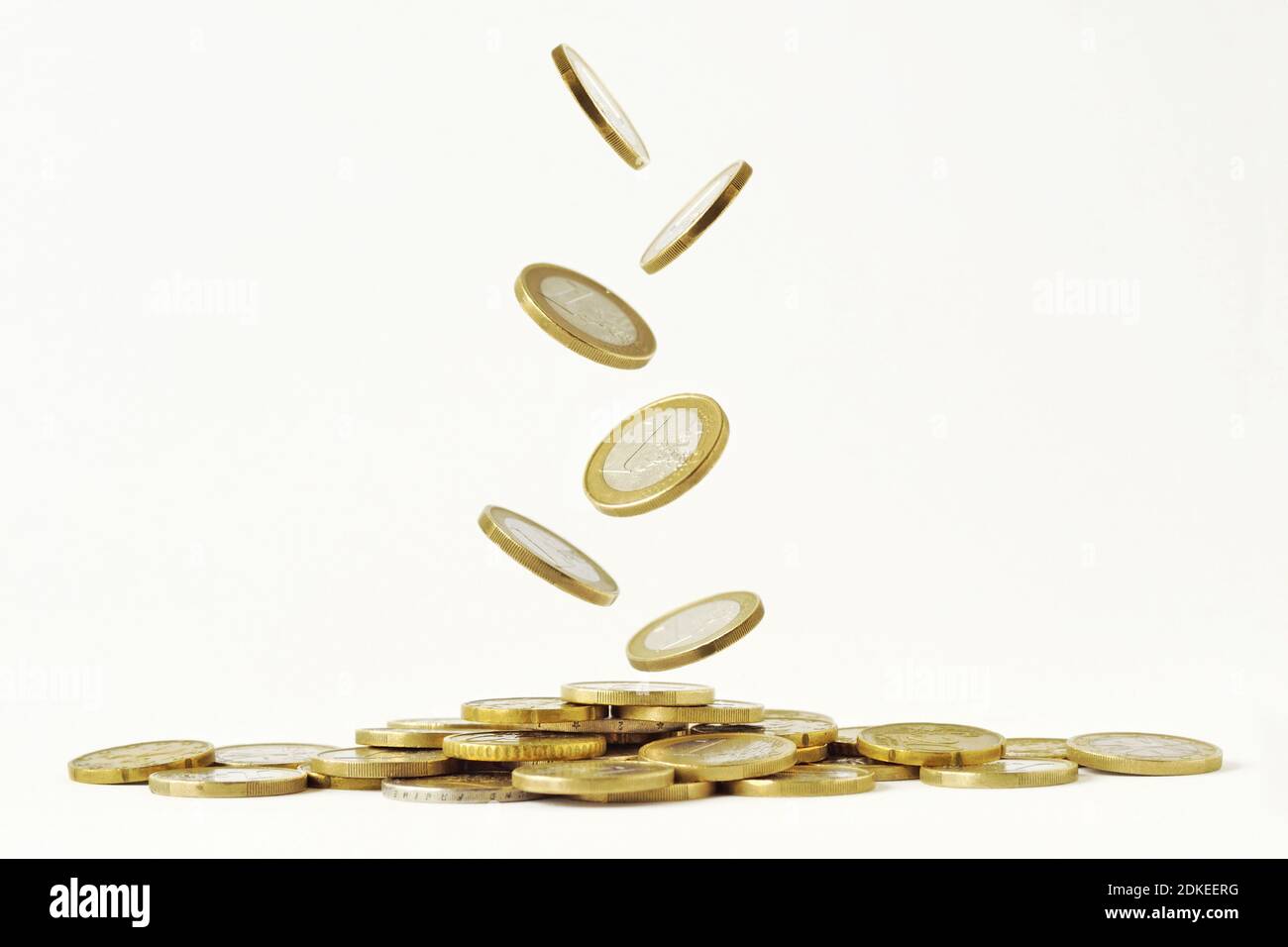 Falling euro coins on white background Stock Photo - Alamy