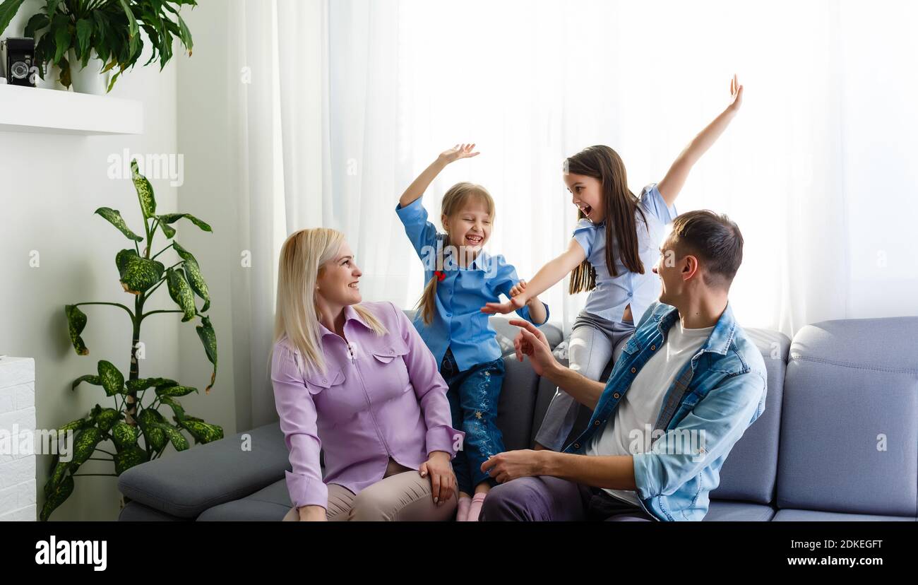 Portrait of a happy family smiling at home Stock Photo - Alamy