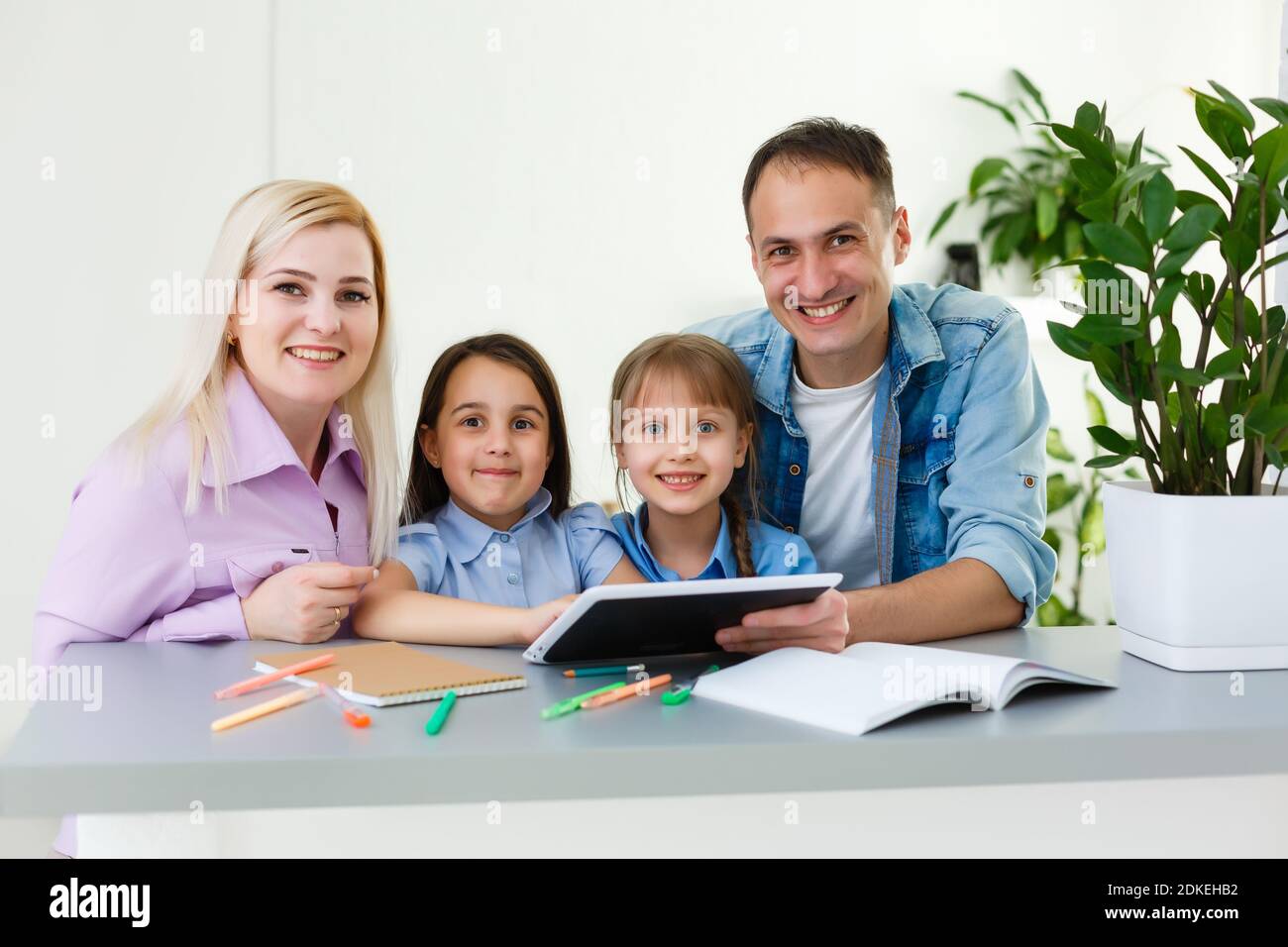 Family Working At Laptop With In Home Office Stock Photo - Alamy