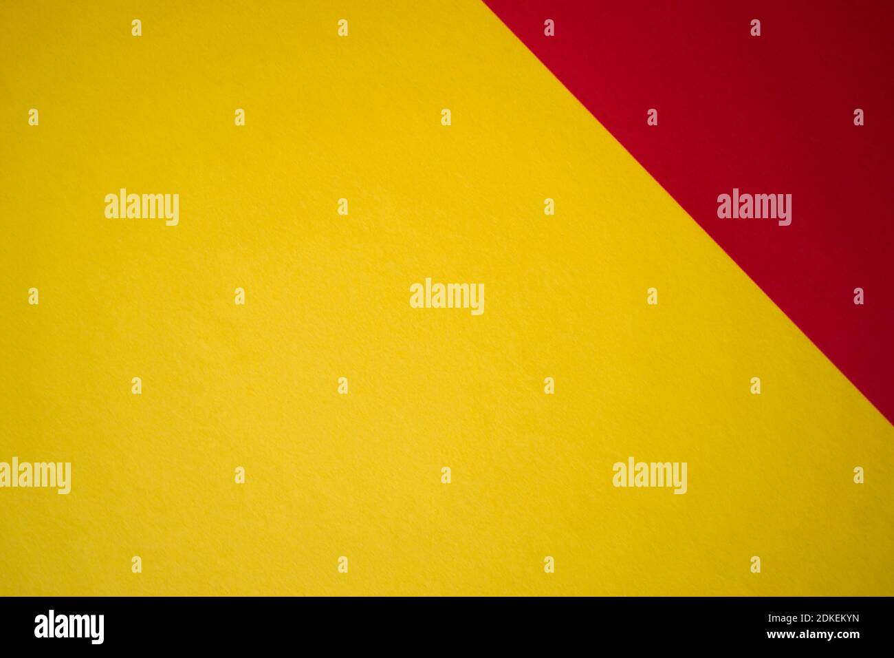 Colored paper yellow and red abstract background Stock Photo - Alamy