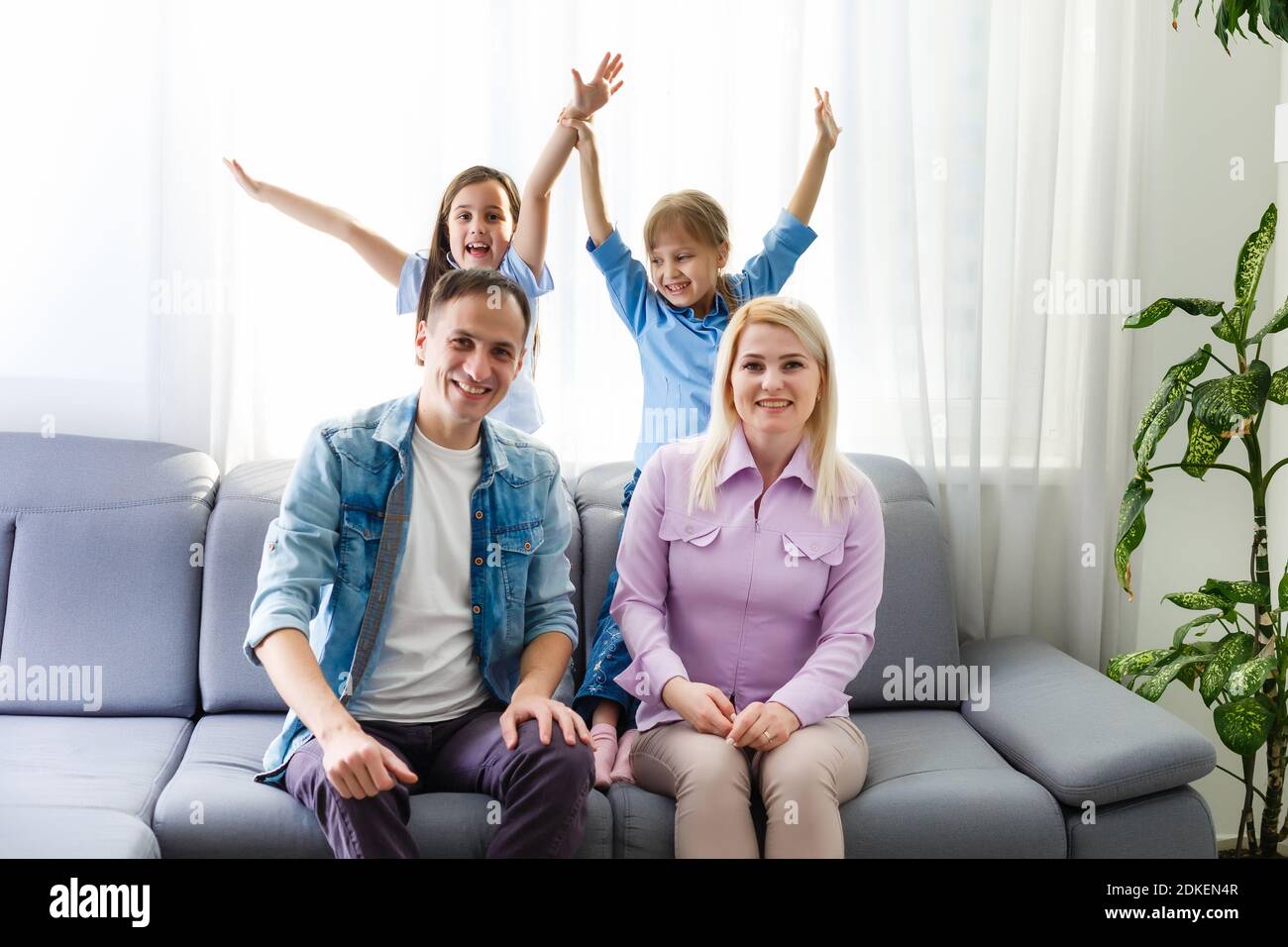 Portrait of a happy family smiling at home Stock Photo - Alamy