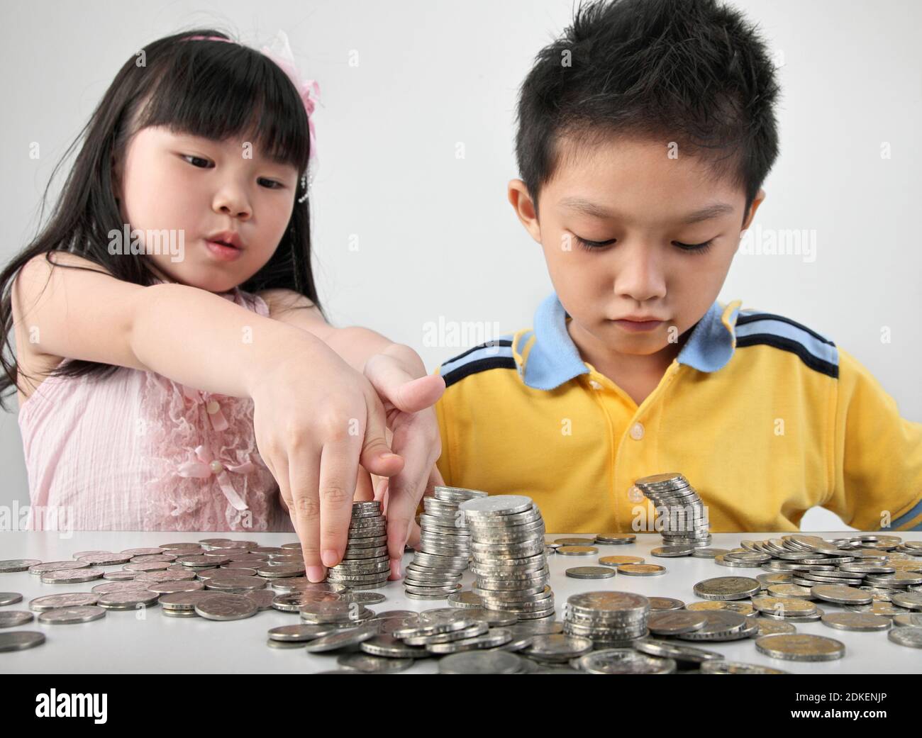 Boy girl counting money hi-res stock photography and images - Alamy