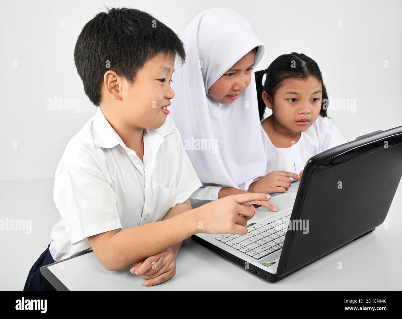 Kids raising hand laptop hi-res stock photography and images - Alamy