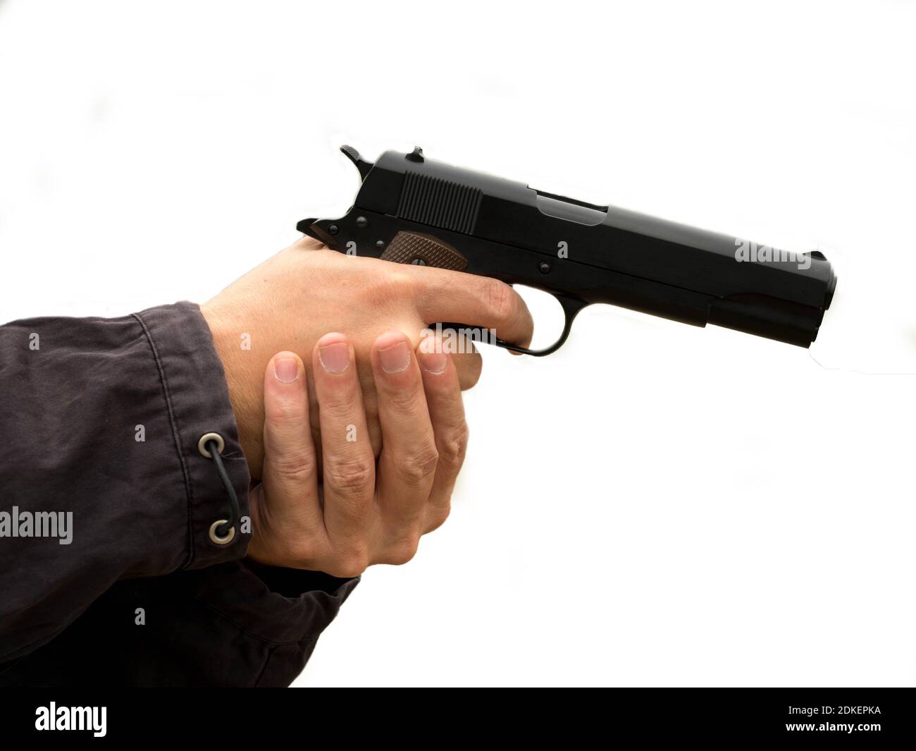 Hand holding revolver isolated hi-res stock photography and images - Alamy