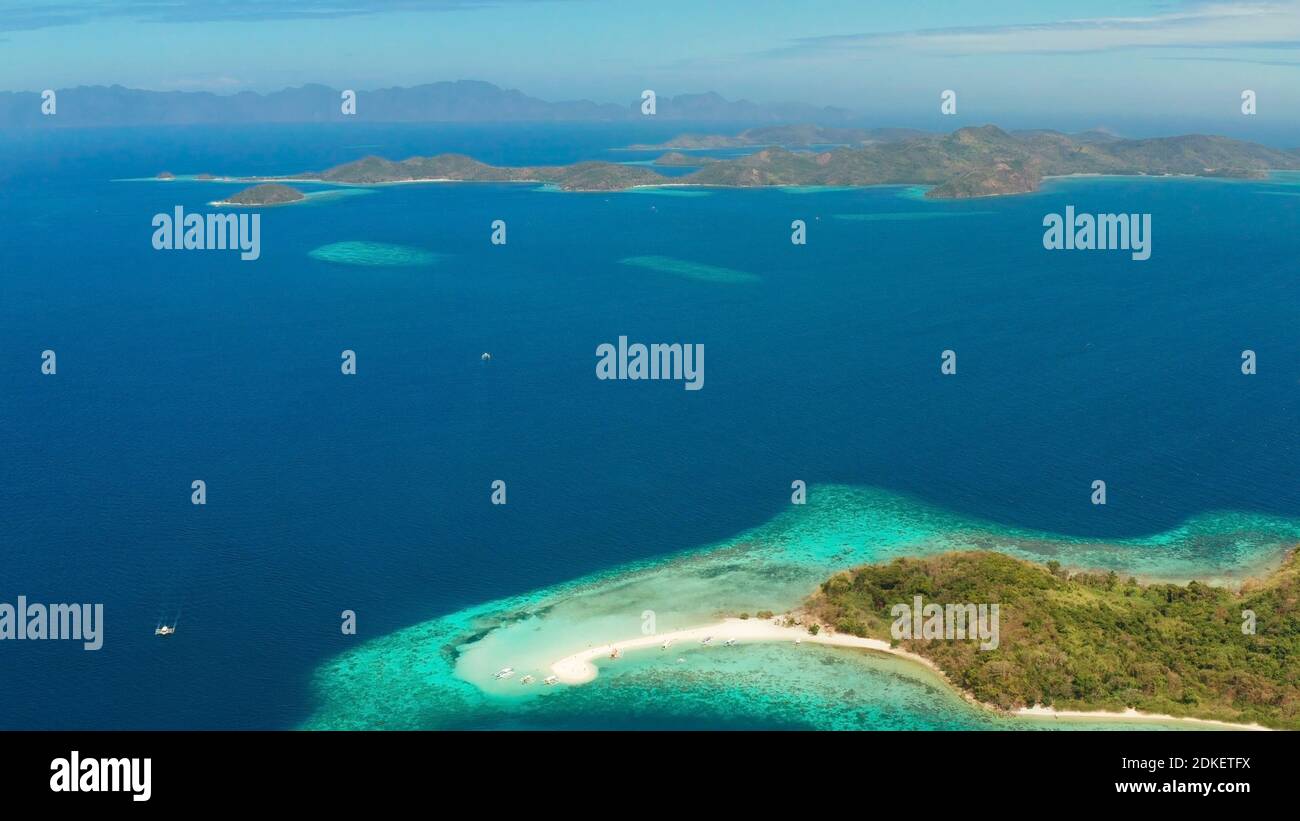 aerial seascape tropical island with sand bar, turquoise water and ...