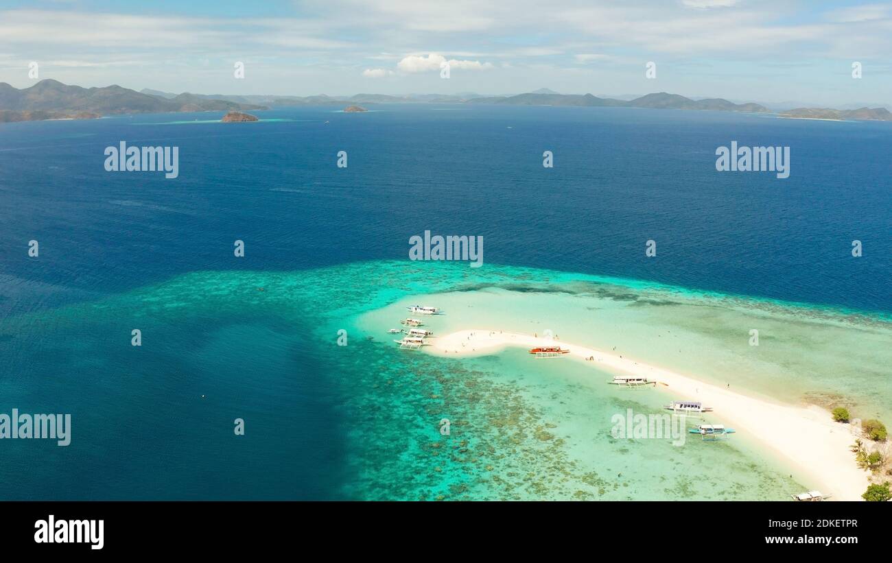 aerial seascape tropical island with sand bar, turquoise water and ...