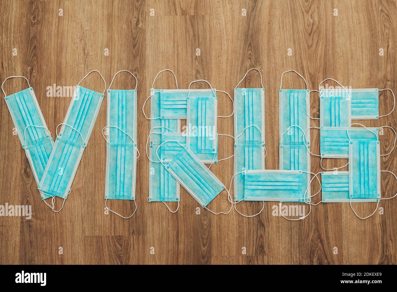 Word Virus Composed of Medical Masks on a Brown Background Stock Photo ...