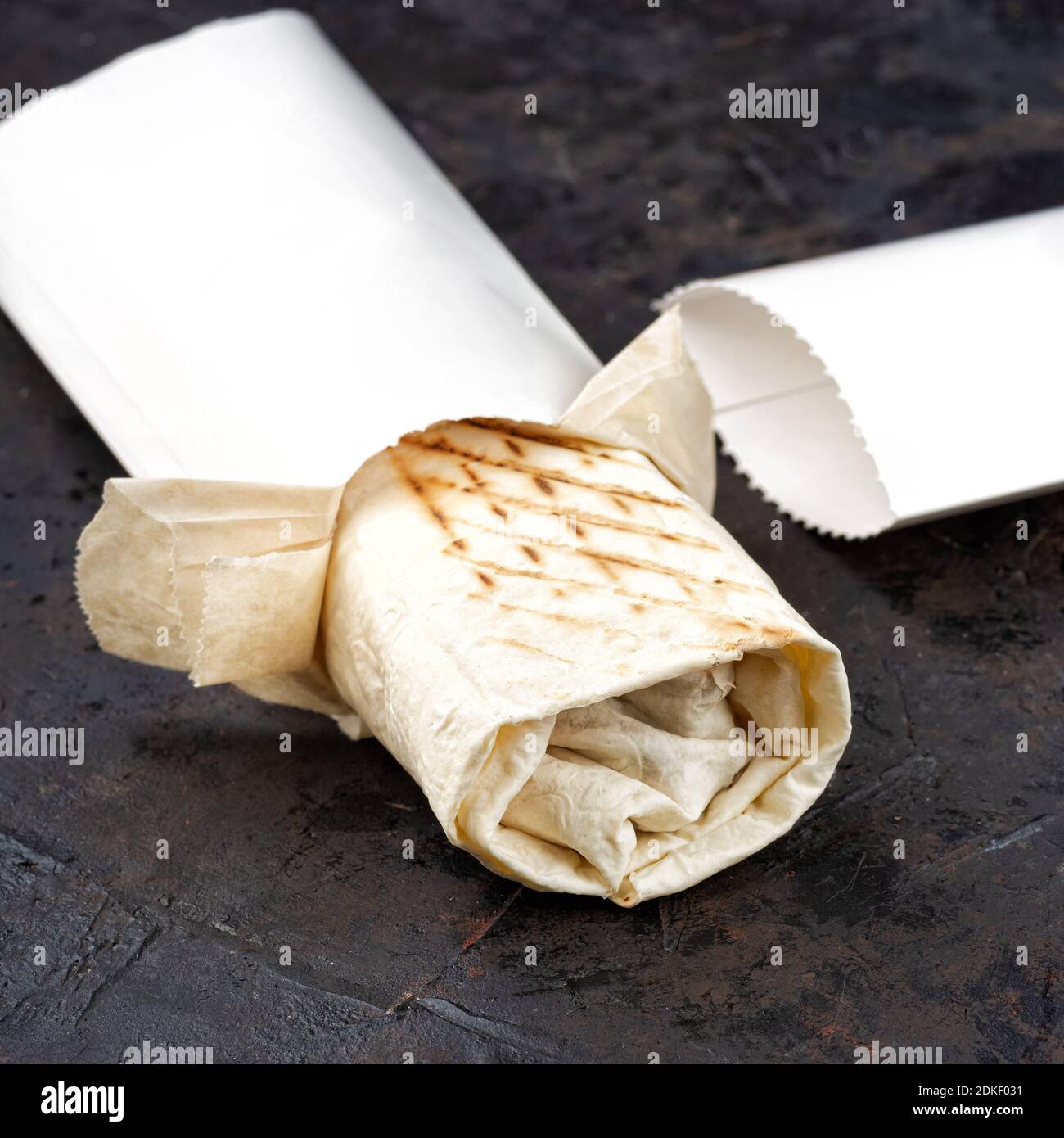 traditional oriental shawarma in Eco-friendly cardboard. dark stone ...