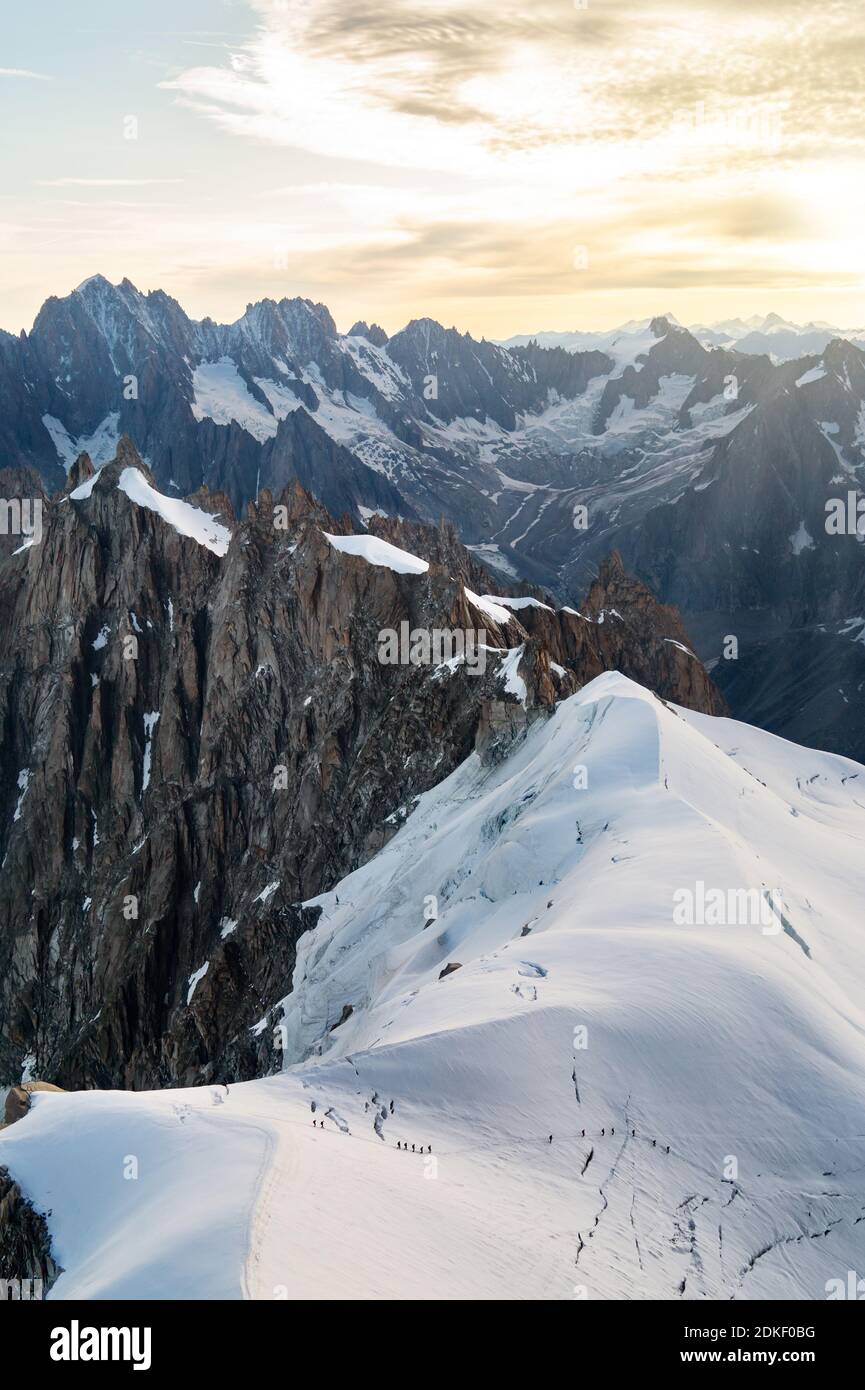 Climbers chain on a snowy mountainside of Mont Blanc Massif. Tourist ...