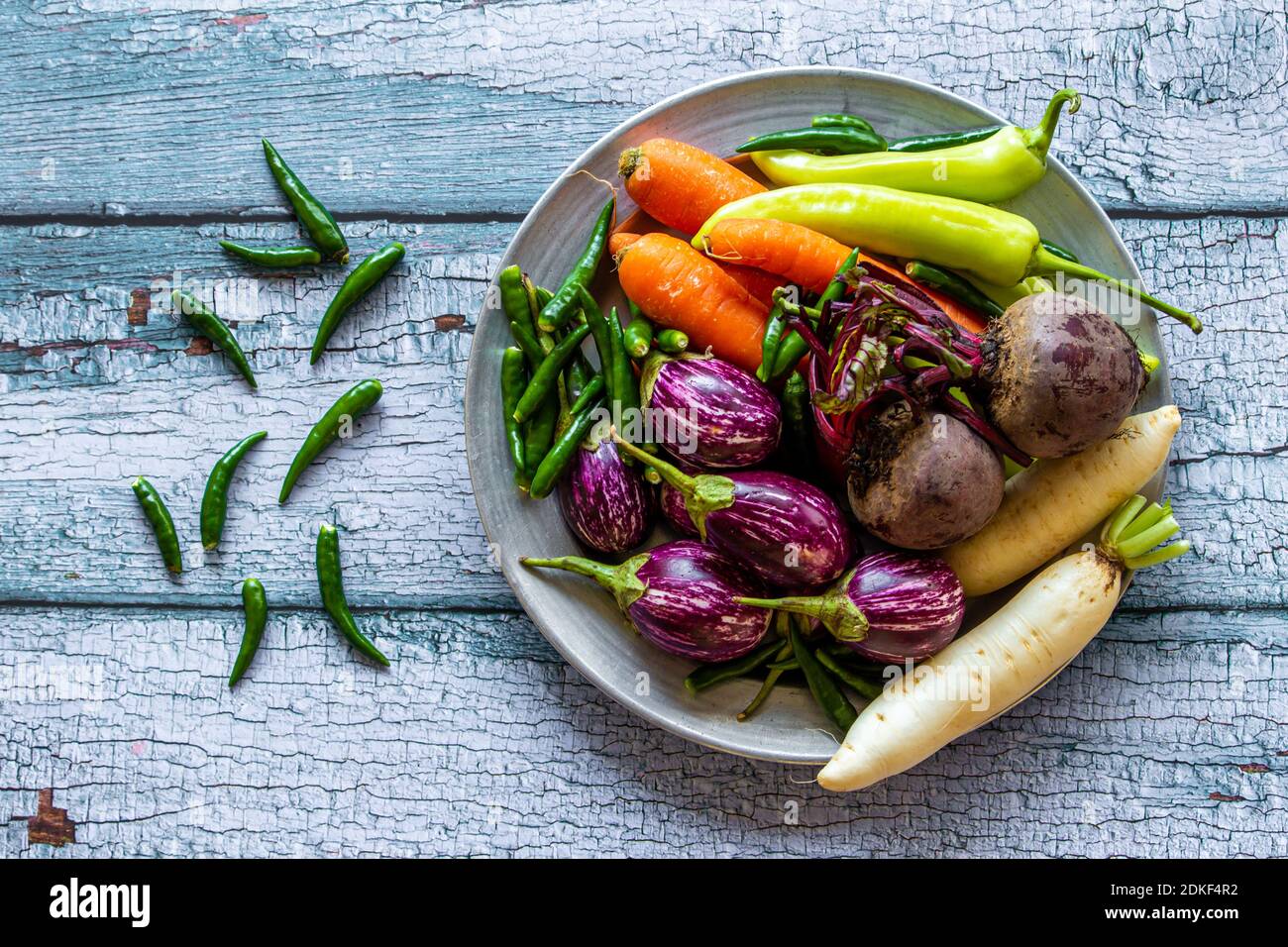 Top view of multi-colored vegetables (carrot, chili pepper, brinjal ...