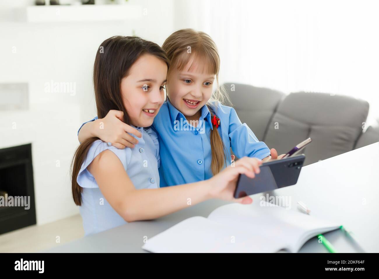 two little girls studying online. Distance Learning Online, e-learning ...