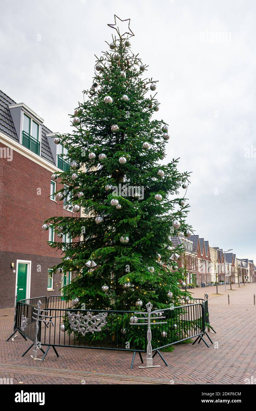 Tall decorated Christmas tree in the centre of a Dutch town Stock Photo ...