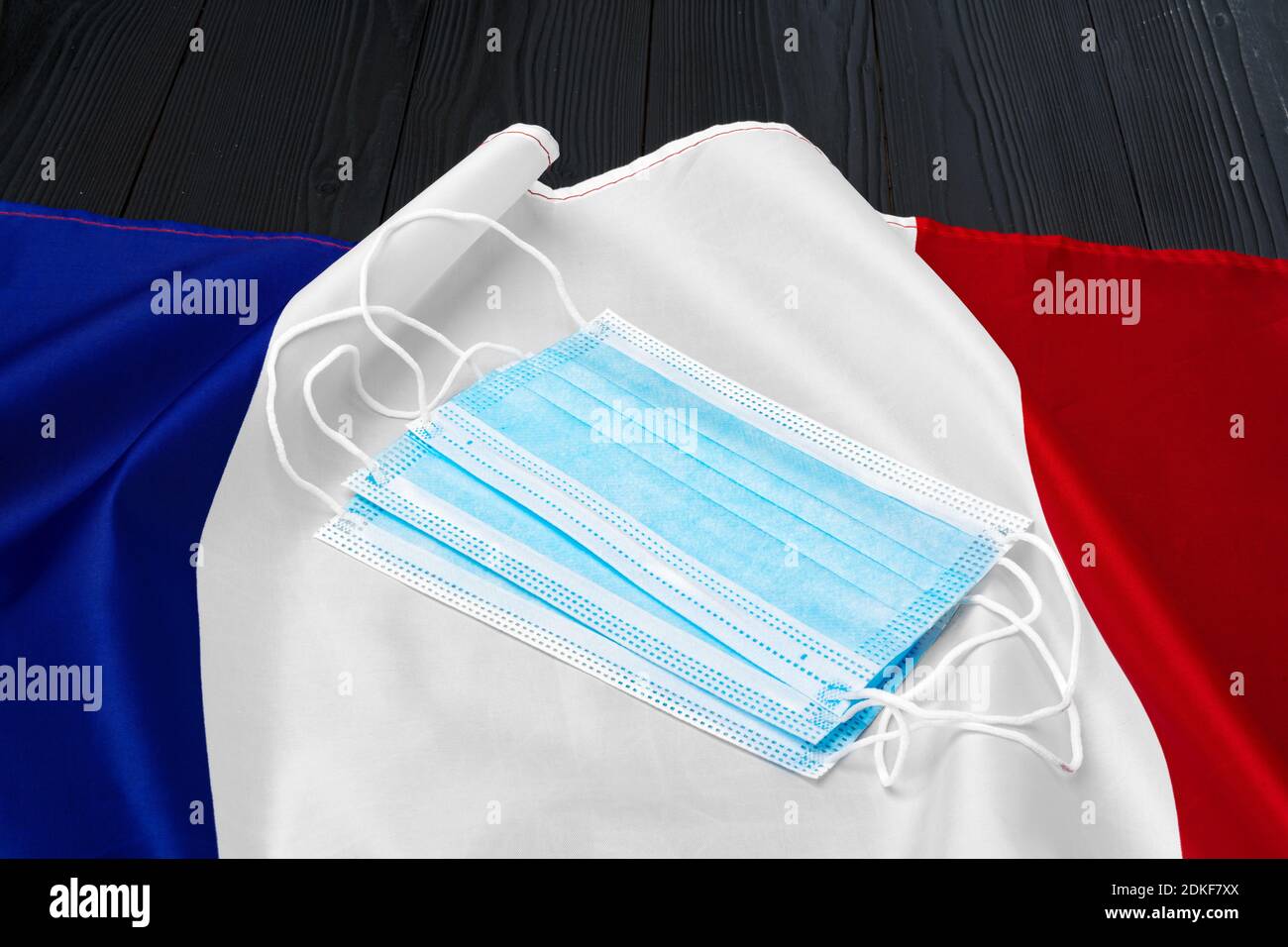 Medical mask on national flag of France Stock Photo - Alamy