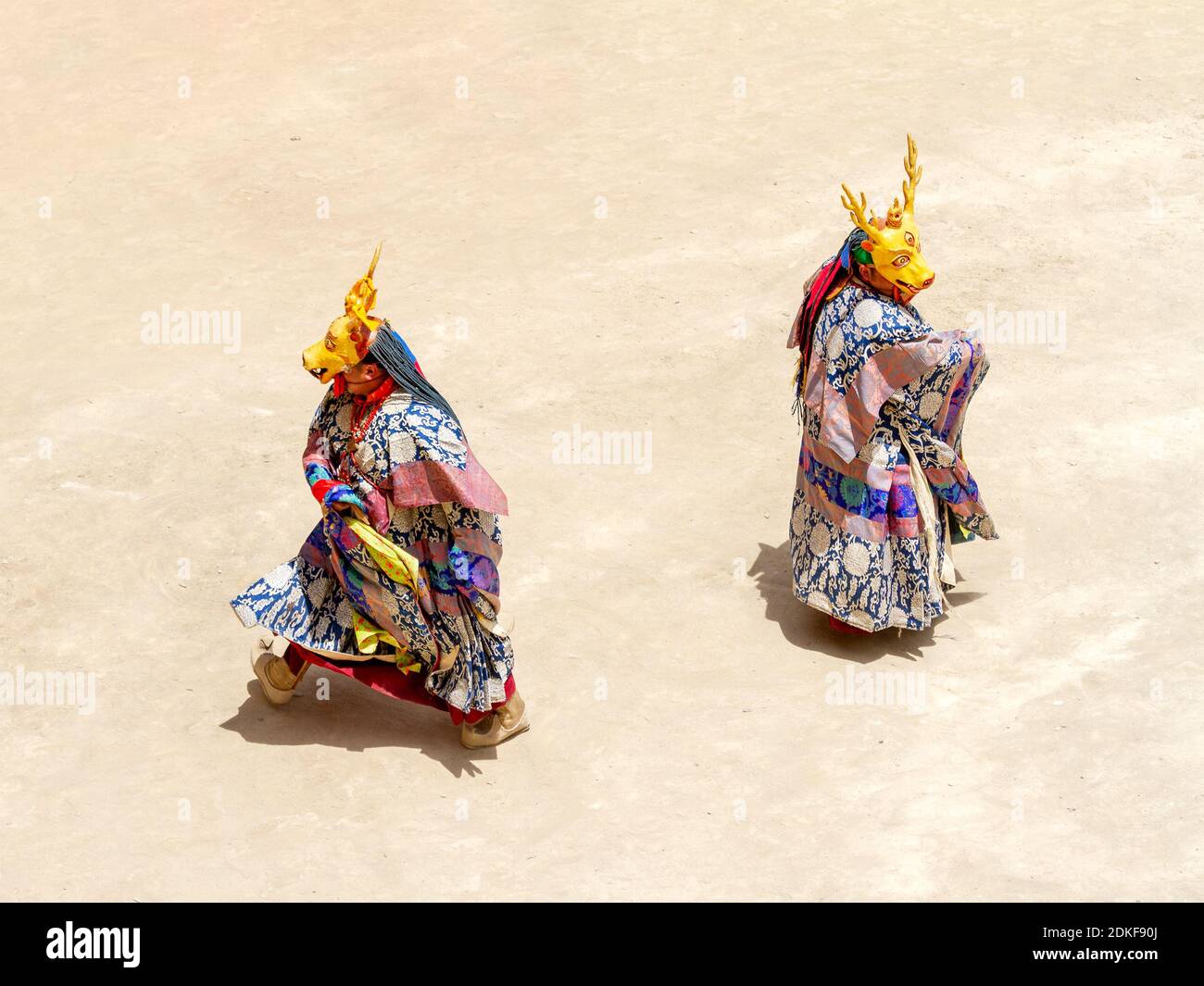 Two unidentified monks in deer mask perform a religious masked and ...