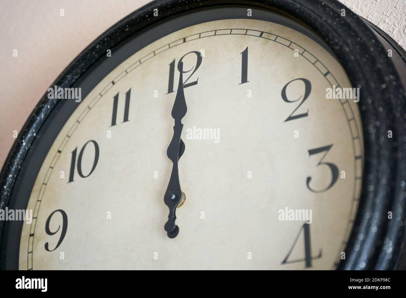 Wall clock marking twelve o'clock on the new year Stock Photo - Alamy
