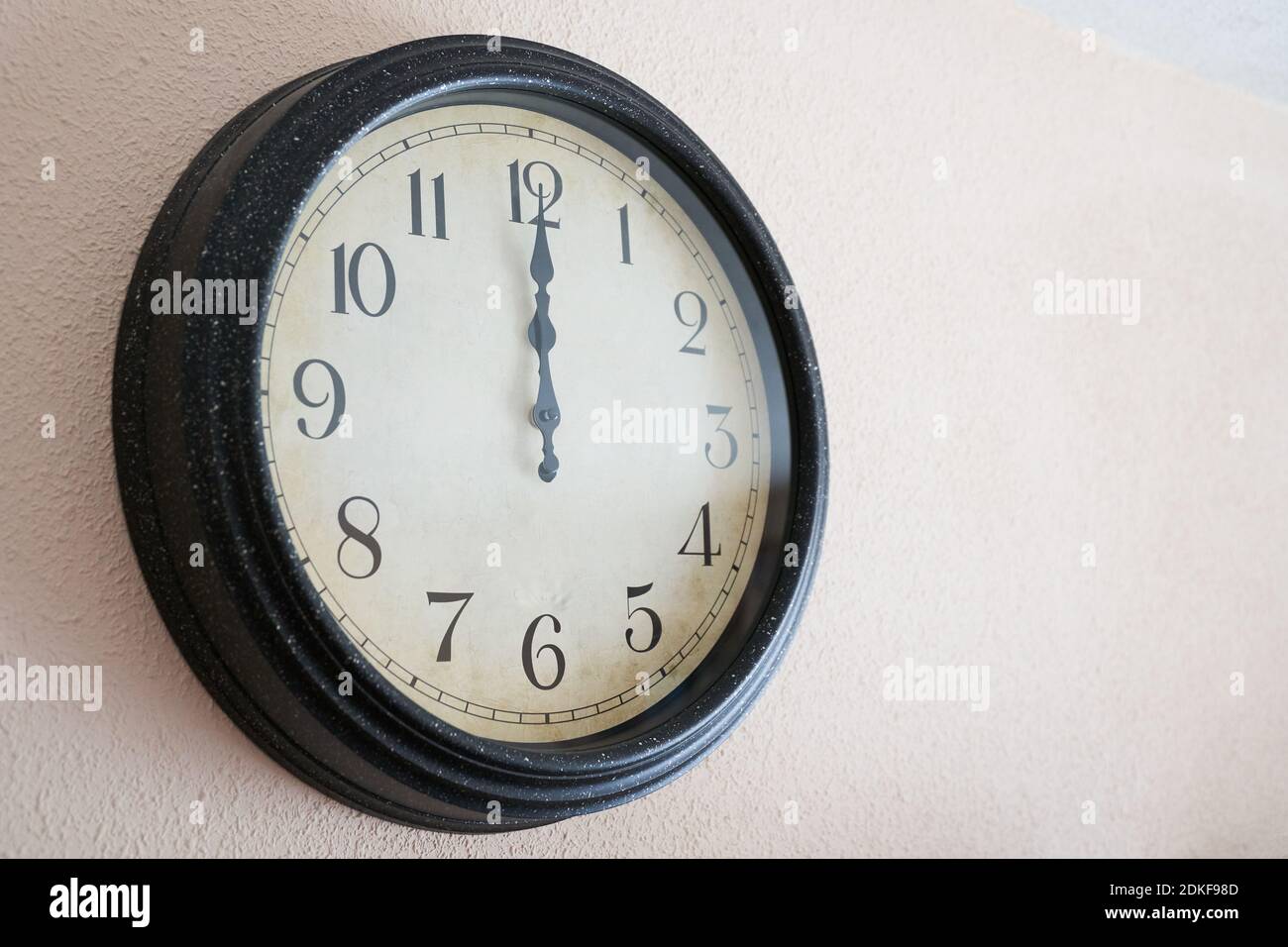 Wall clock marking twelve o'clock on the new year Stock Photo - Alamy