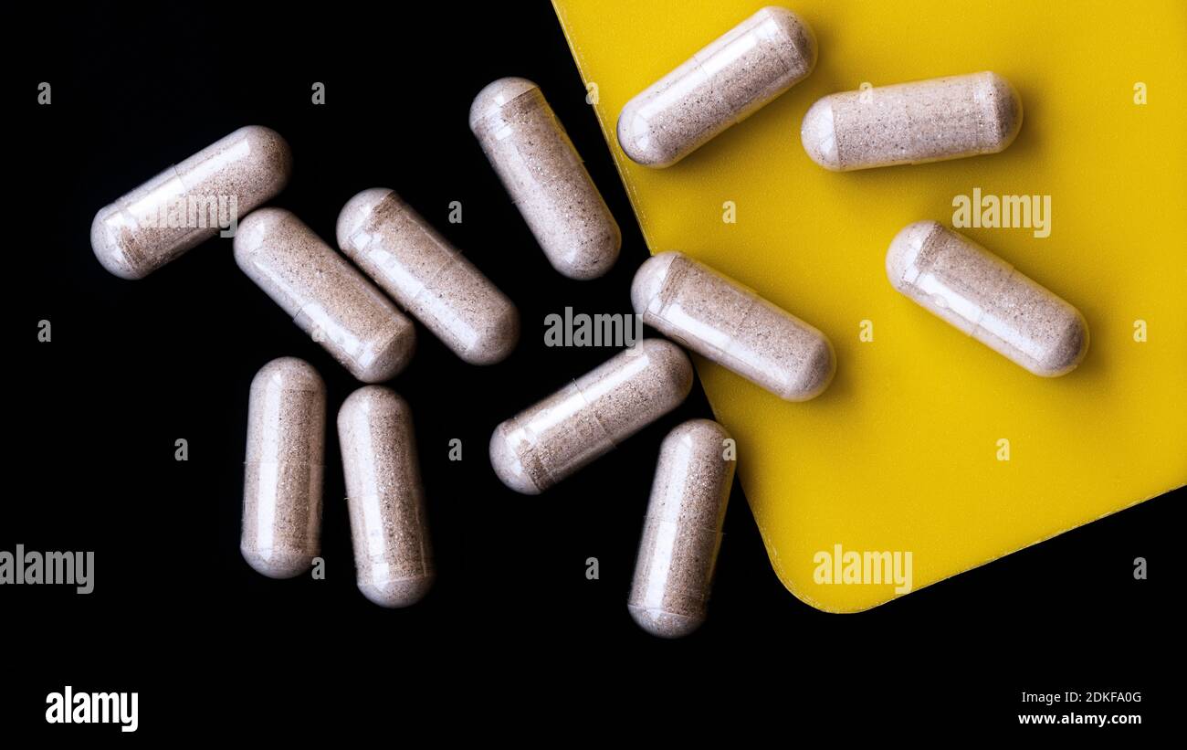 close-up of slippery elm capsules. dietary concept. dietary supplement ...