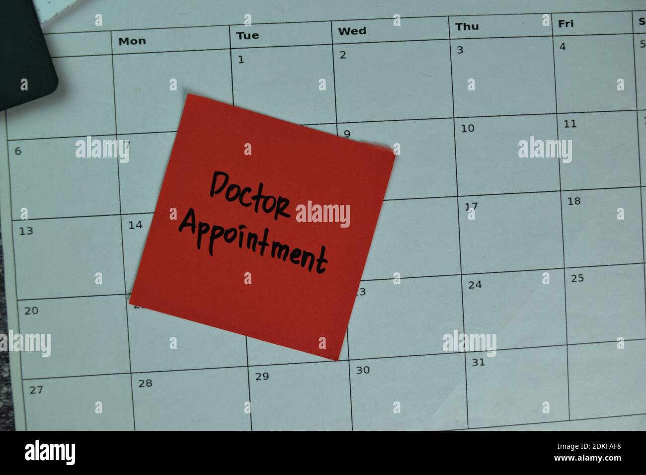monthly Calendar and Doctor Appointment write on sticky notes isolated ...