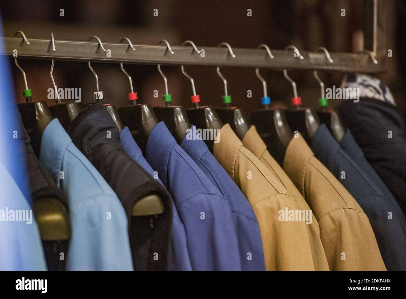 men clothing on hanger in a shop - shopping in mall concept Stock Photo ...