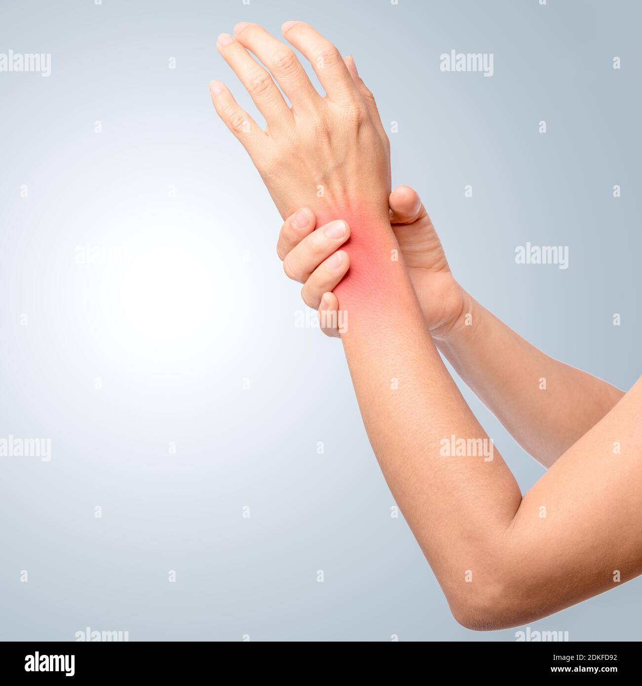 right hand holding left wrist joint and swelling around joint Stock ...