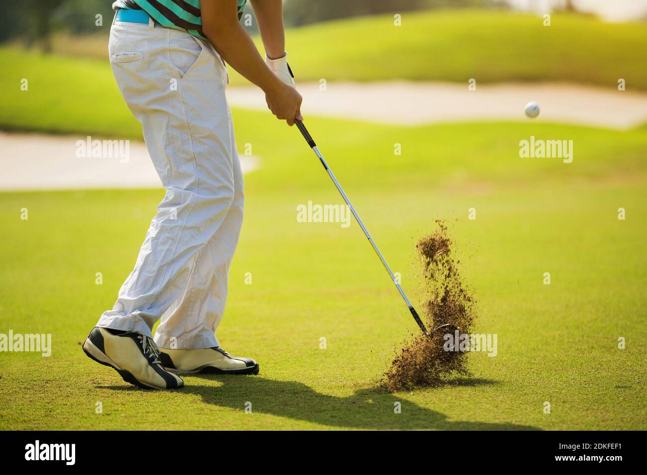 Golfer hitting ball with force. The grass distribution The blur of golf ...