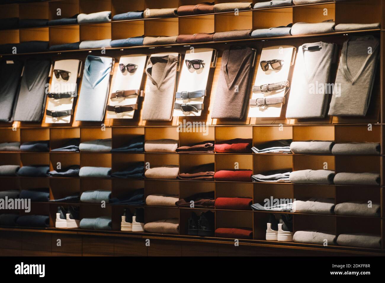 Men shirts in a clothing store - shopping concept Stock Photo - Alamy